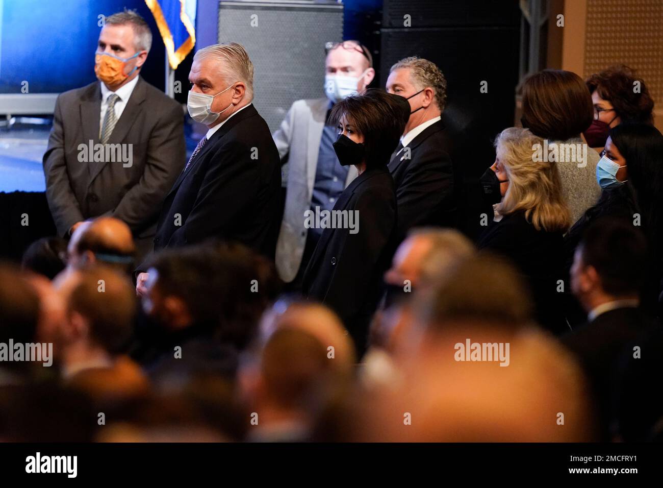 Nevada Gov. Steve Sisolak, second from left, attends a memorial service ...
