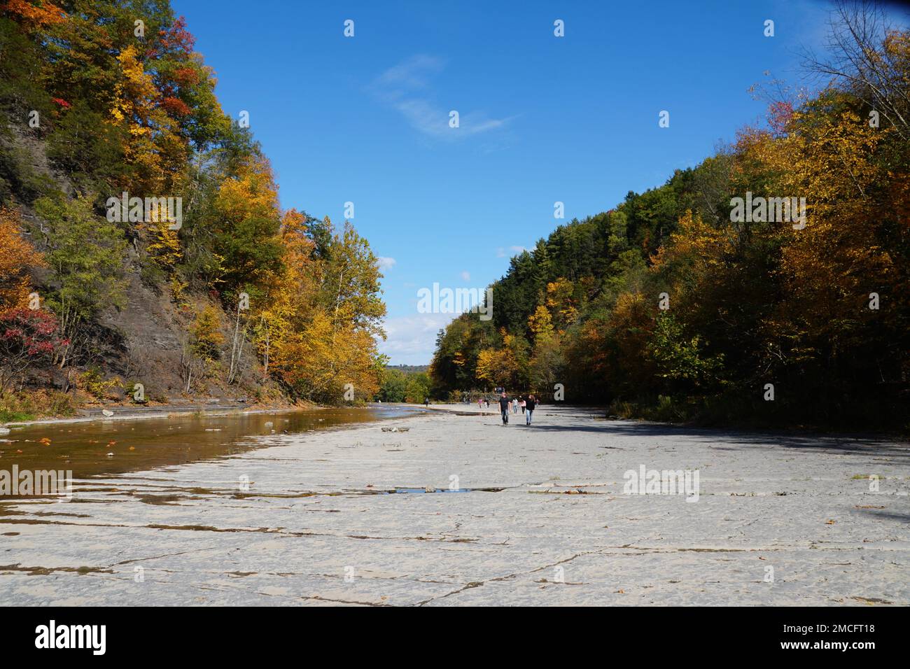 The flat rock and river bed at Taughannock Falls with the background of ...