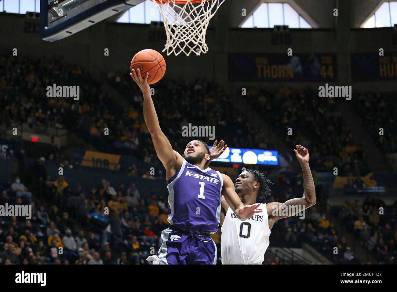 Kansas State guard Markquis Nowell (1) shoots as West Virginia guard ...