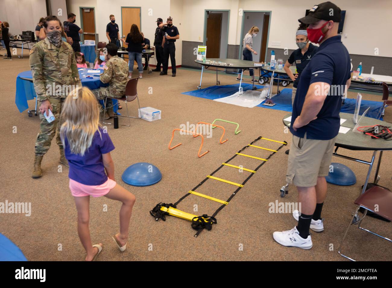 Fitness personnel from Buckley Spaceforce Base explain to children of ...