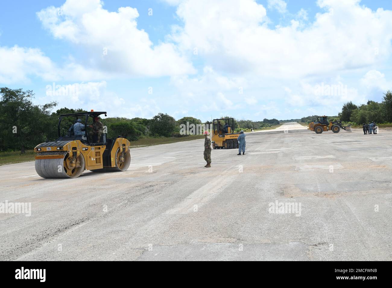 U.S. Air Force and Repulic of Singapore Airmen operate heavy machinery ...