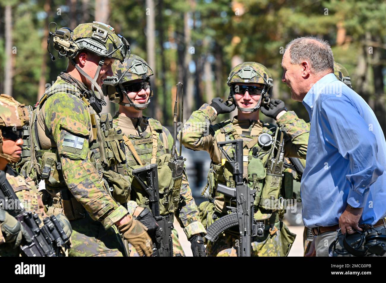 Members of the U.S. Congress speak with Finnish soldiers assigned to ...