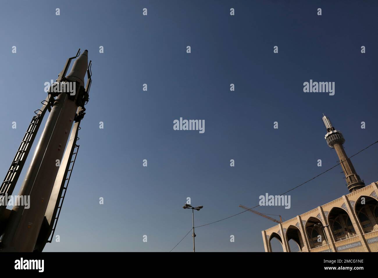 Qiam missile is displayed in front of a minaret of Imam Khomeini grand ...