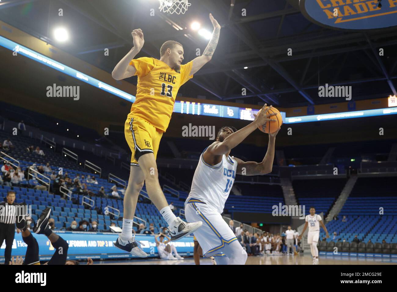 UCLA center Myles Johnson (15) fakes Long Beach State forward Romelle ...