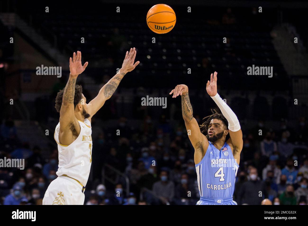 North Carolina's RJ Davis (4) shoots a 3-pointer in front of Notre Dame's Prentiss Hubb (3 ...