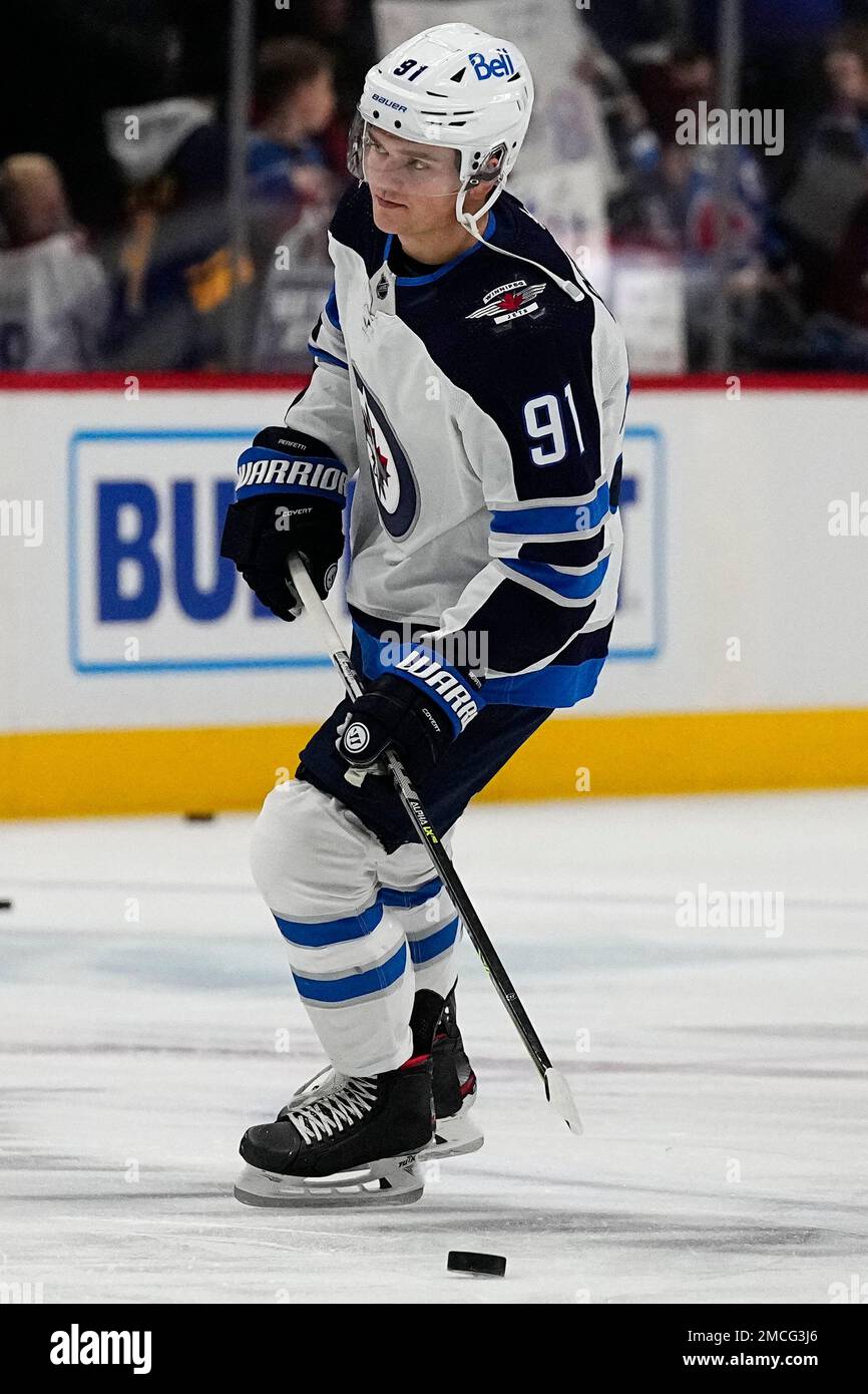 Winnipeg Jets forward Cole Perfetti warms up before the start of an NHL ...