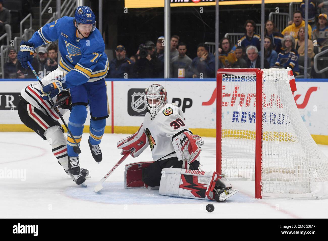 St. Louis Blues' Niko Mikkola (77) attempts a shot against Chicago ...