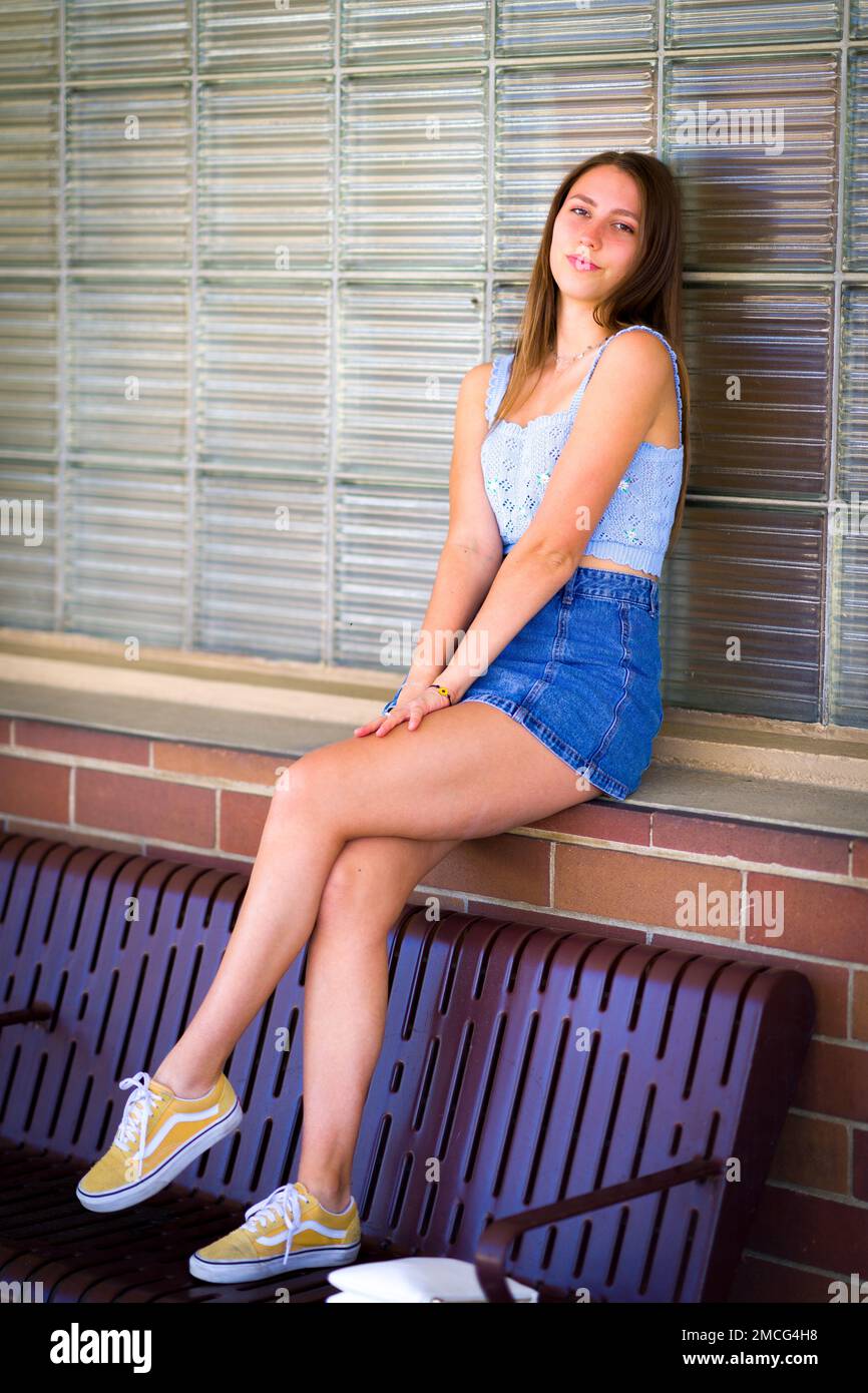 Full Body Body Portrait of Teenage Girl Sitting on Window Sill in Front ...