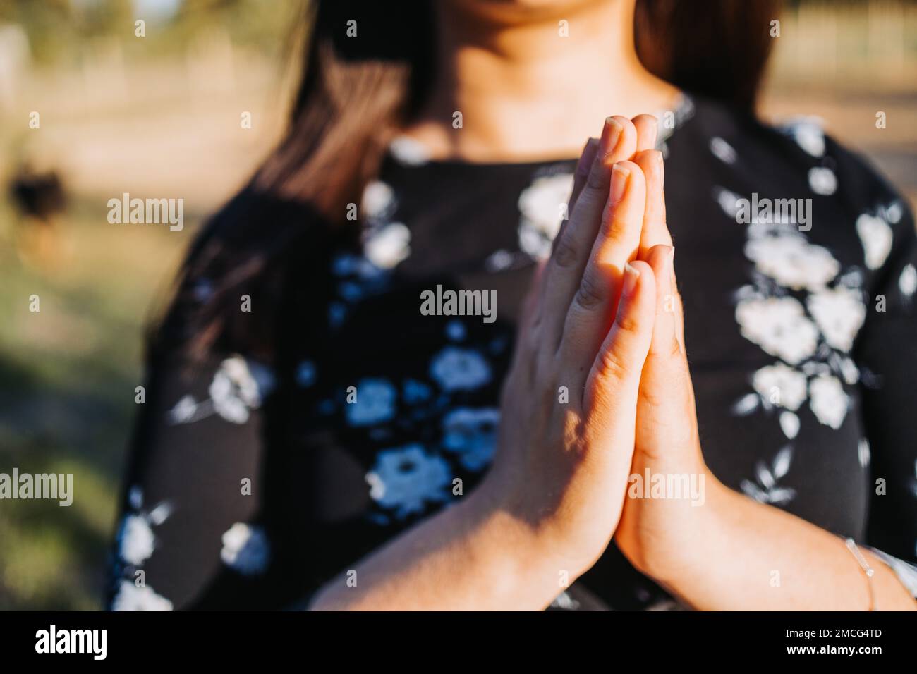 Religious believer woman praying, putting hands together to receive God ...