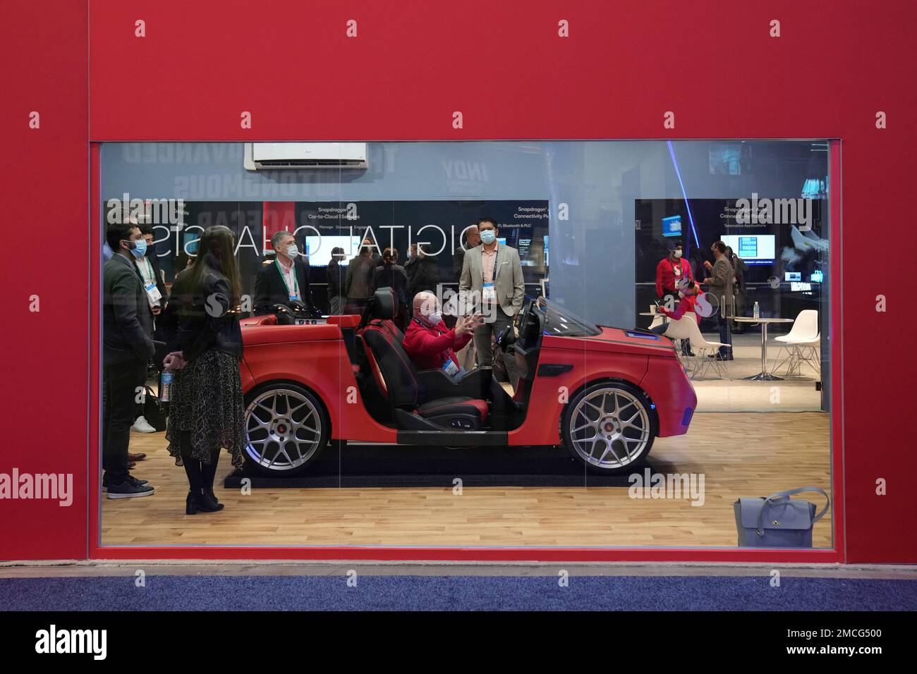 People view the Snapdragon Digital Chassis at the Snapdragon booth ...