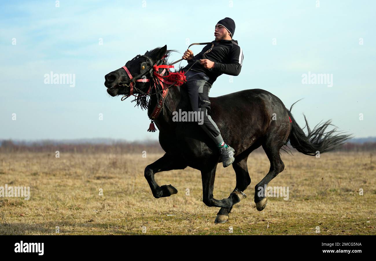 A man rides a horse during Epiphany celebrations in the village of ...