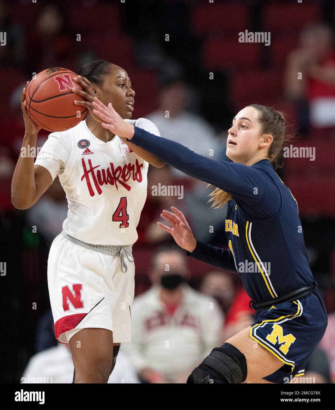 Michigan's Amy Dilk (1) plays against Nebraska's Sam Haiby (4) during ...