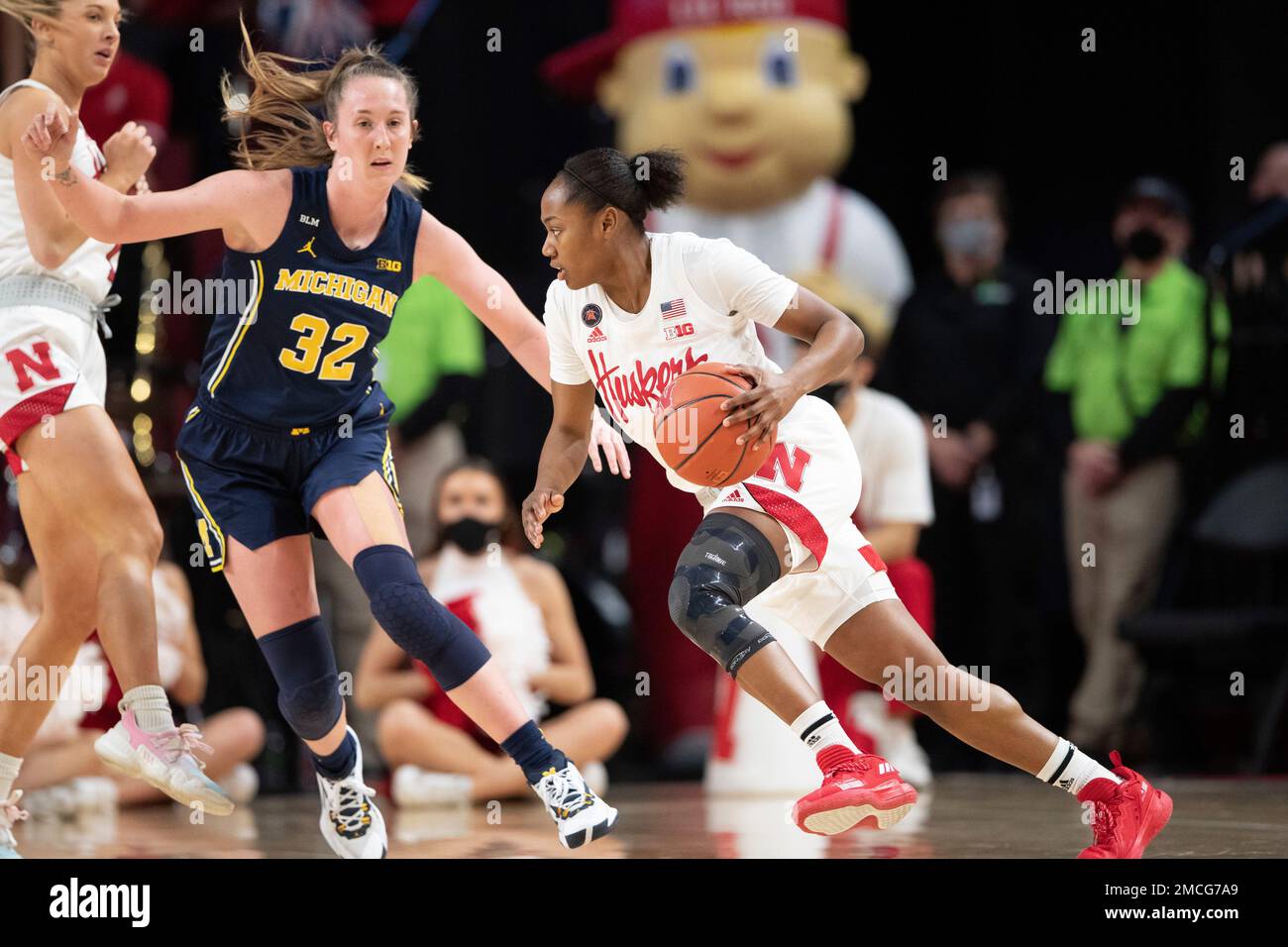 Nebraska's Sam Haiby (4) drives against Michigan's Leigha Brown (32 ...