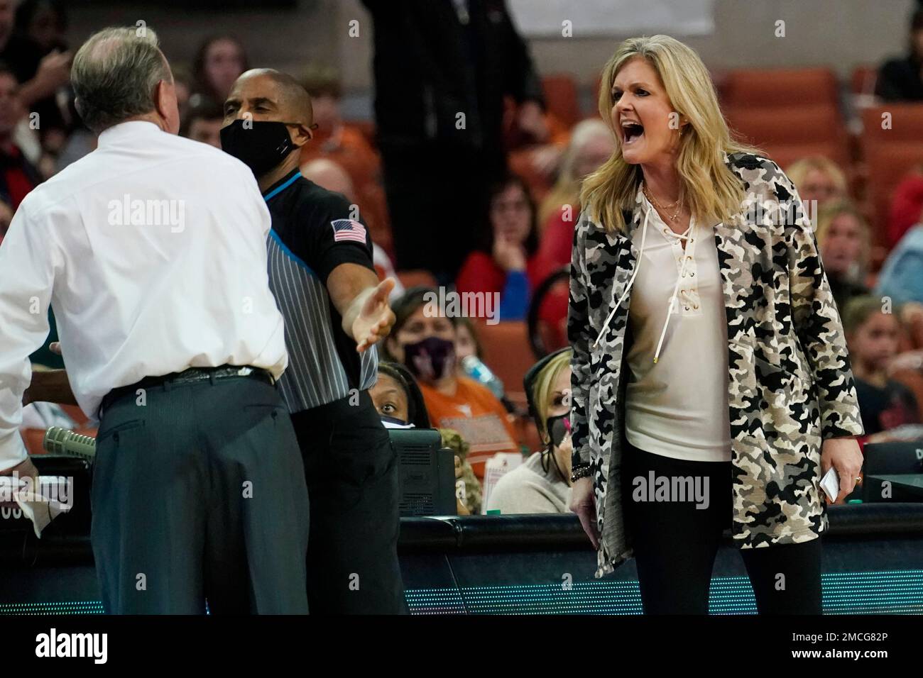 Texas Tech head coach Krista Gerlich, right, and Texas head coach Vic ...