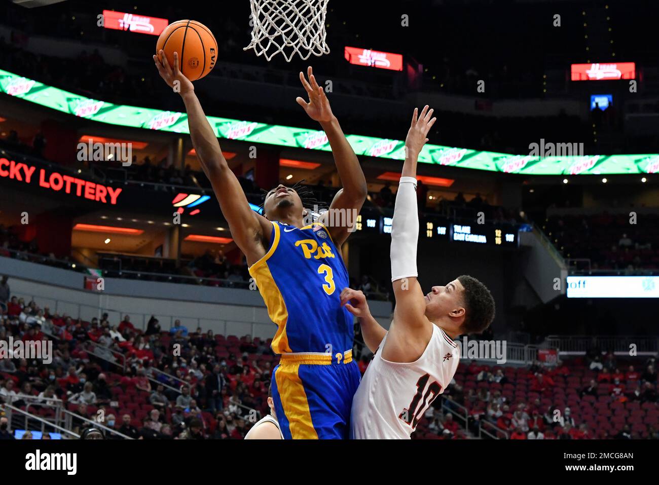 Pittsburgh forward Noah Collier (3) attempts a layup over Louisville ...
