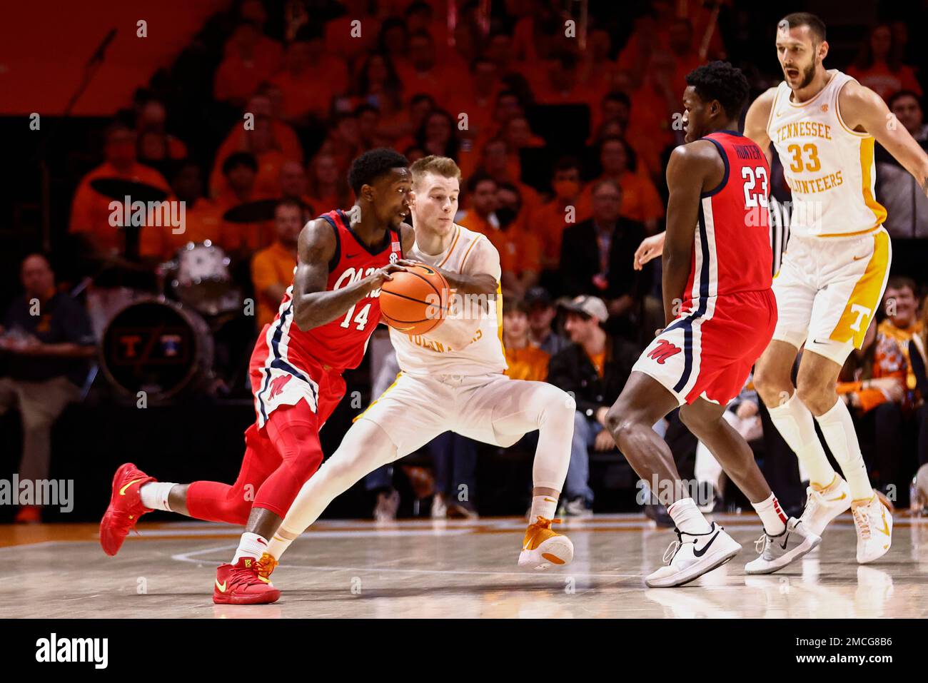 Mississippi guard Tye Fagan (14) drives past Tennessee guard Justin ...