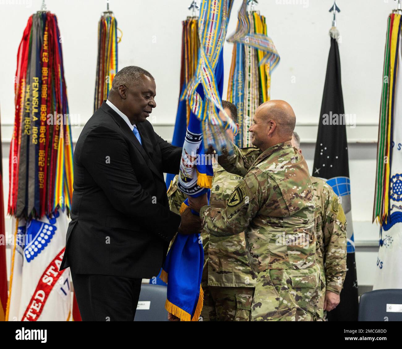 U.S. Secretary of Defense Lloyd J. Austin III hands the EUCOM guidon to ...