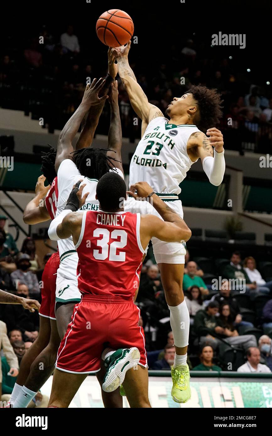 South Florida guard Caleb Murphy (23) grabs a rebound over Houston ...