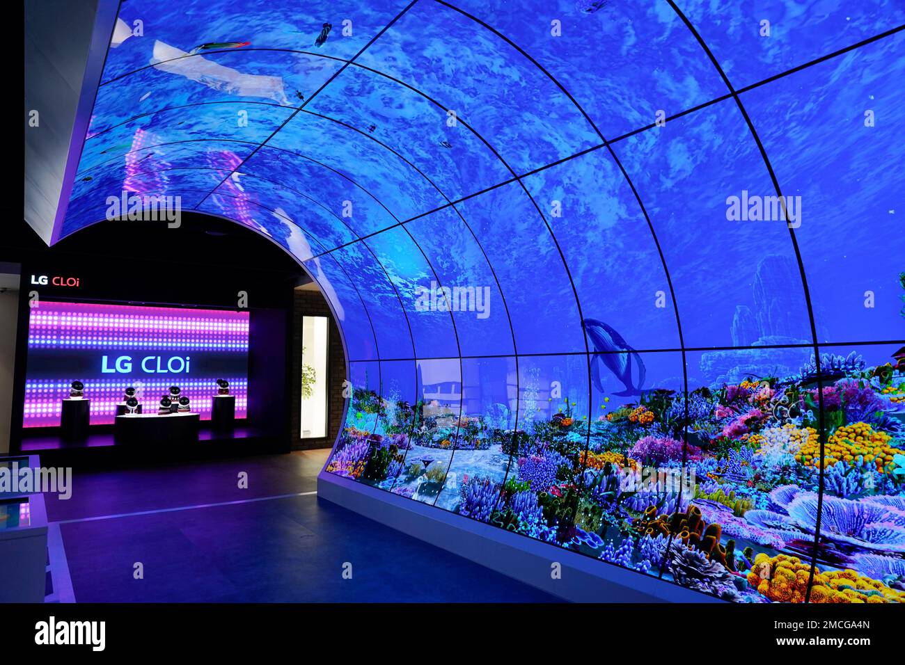 A set of OLED screens, curved in the shape of a wave, displays an ...