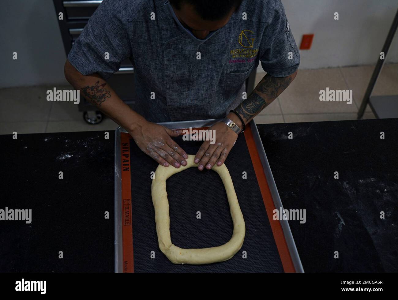 Chef Francisco Vasquez makes a traditional "Rosca de Reyes" pastries at ...