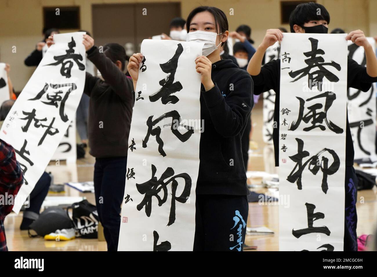 Participants show their works of traditional Japanese calligraphy ...