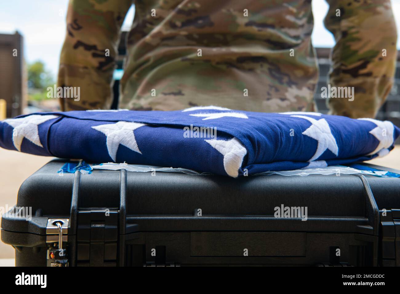 A U.S. flag rests over recovered remains during a dignified transfer ...