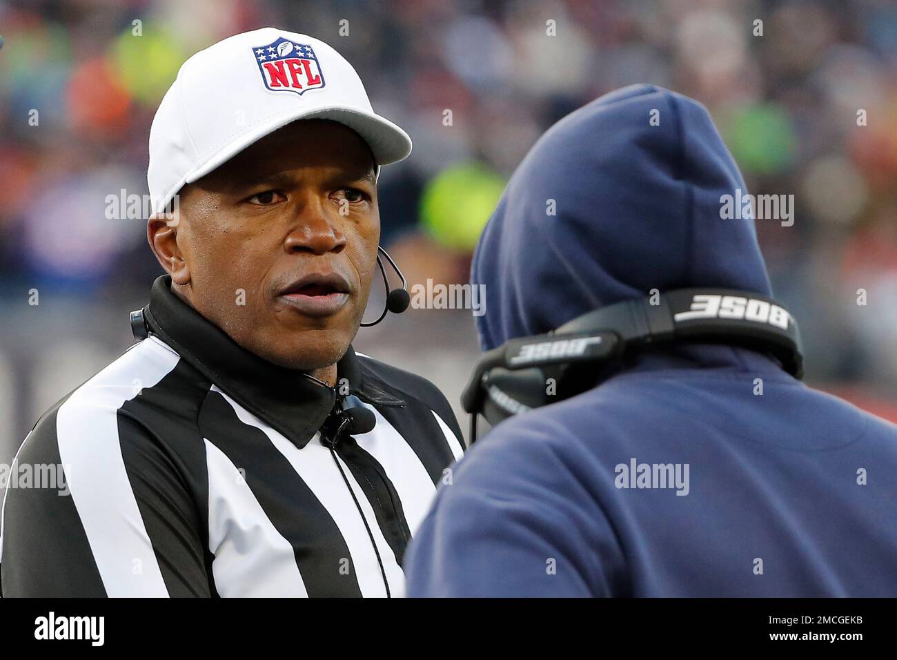 Referee Shawn Smith (14) talks with Bill Belichick during an NFL ...