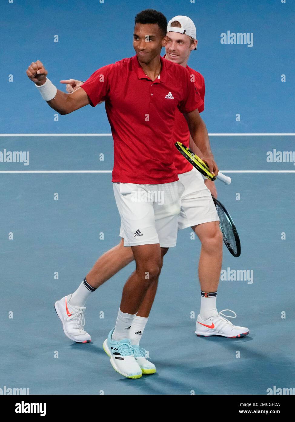 Canada's Denis Shapovalov and teammate Felix Auger-Aliassime, left, celebrate after defeating ...