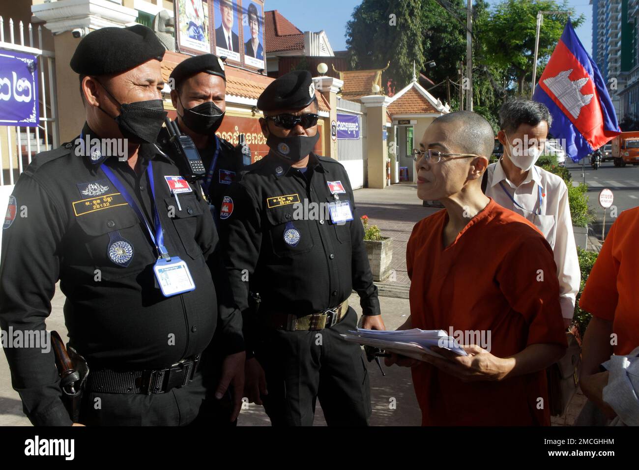 Theary Seng, right, a Cambodian-American lawyer, dressed in a prison-style orange outfit, talks ...