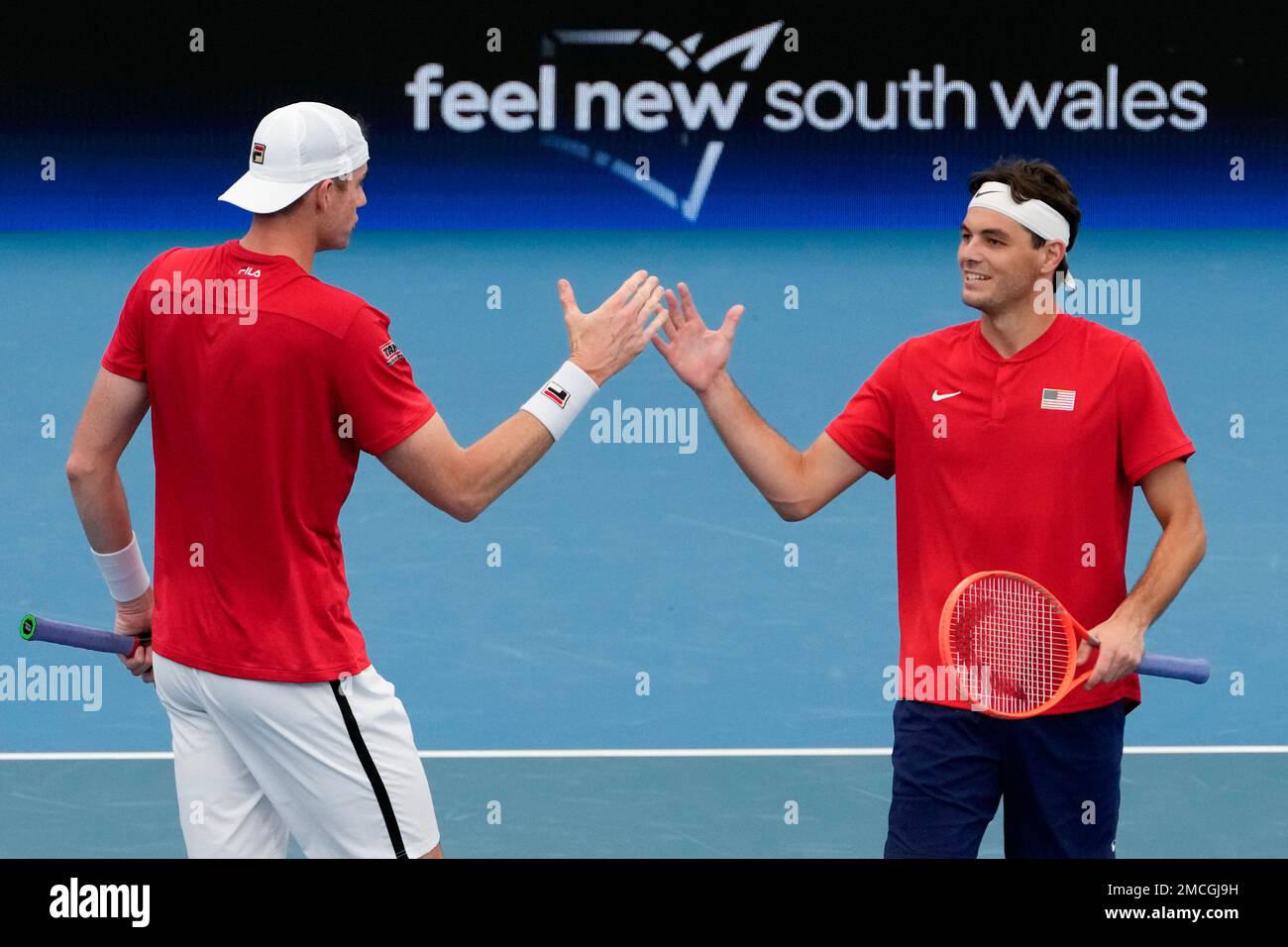 United States' Taylor Fritz and teammate John Isner, left, celebrate ...