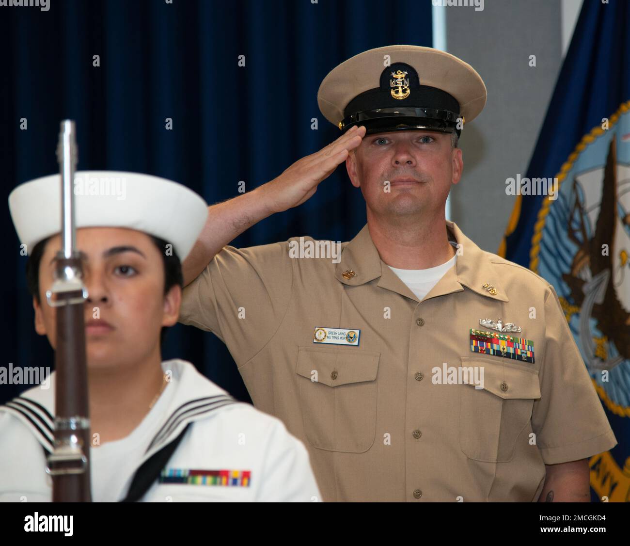 NEWPORT, R.I. (July 1, 2022) Master Chief Musician Gresh Laing salutes ...