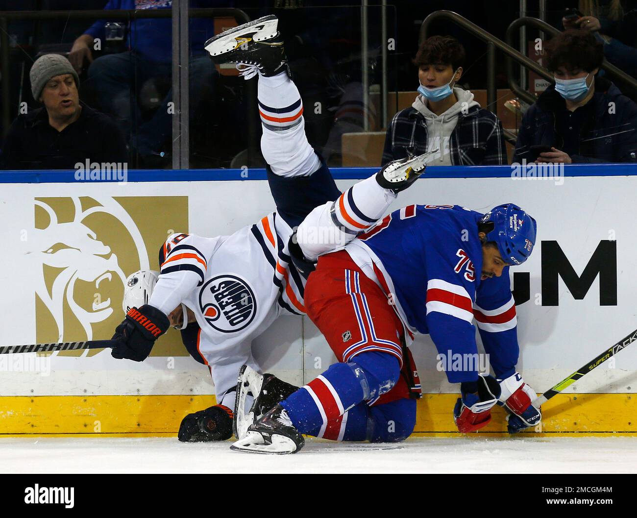 Edmonton Oilers' Colton Sceviour (70) falls over New York Rangers' Ryan ...