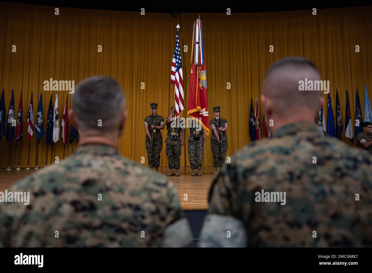U.S. Marines assigned to 1st Marine Aircraft Wing (MAW) stand at ...