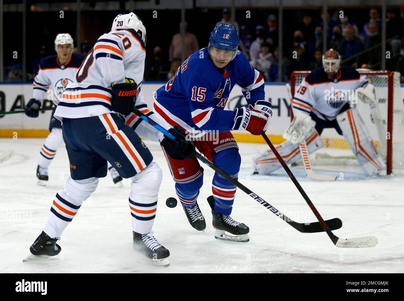 New York Rangers' Julien Gauthier (15) and Edmonton Oilers' Slater ...