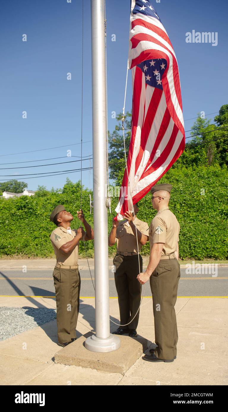 U.S. Marines, DoD civilians, retirees, and guests take part in a ribbon ...