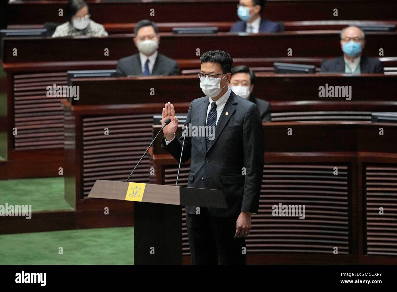 Newly elected pro-Beijing lawmaker Stanley Ng Chau-pei takes his oath during the oath-taking ...