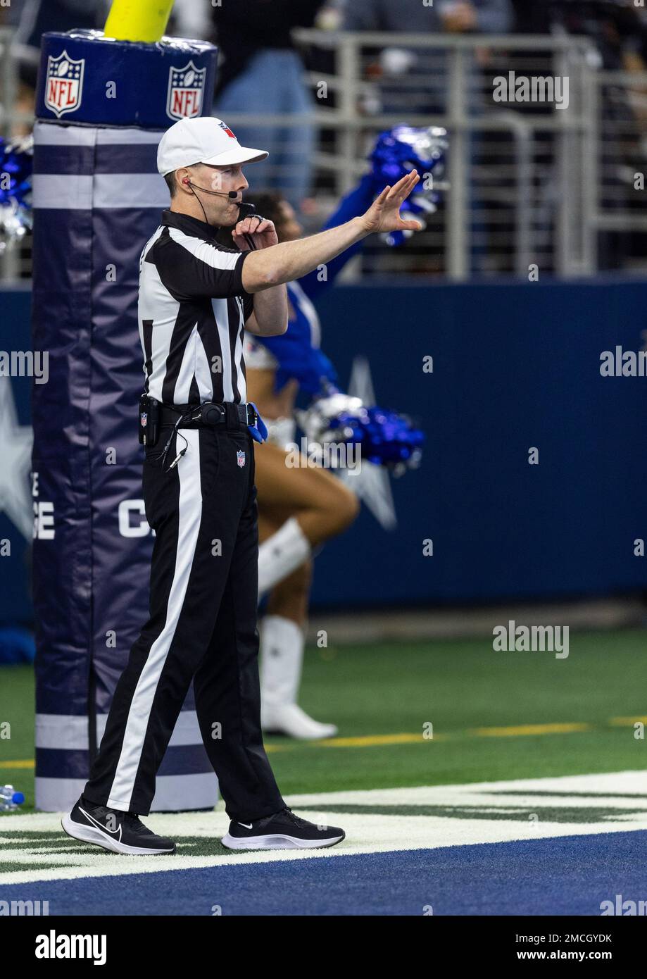 Referee Scott Novak (1) signals during an NFL football game between the ...