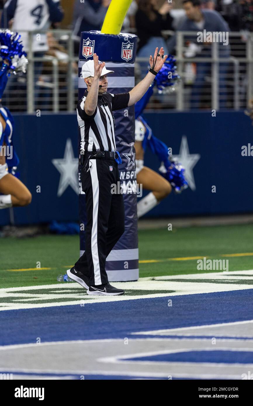Referee Scott Novak (1) signals during an NFL football game between the ...