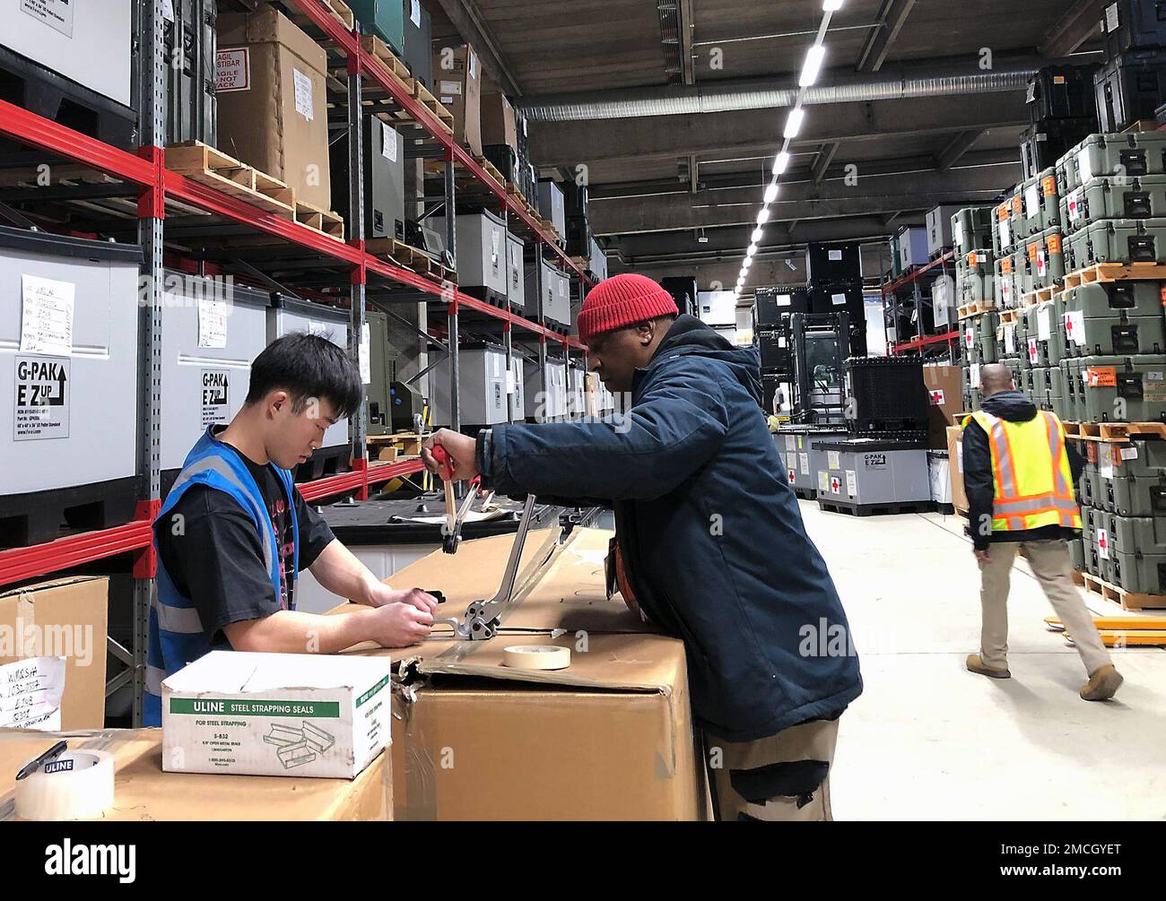 Cpl. Thien Nguyen, left, medical supply technician with the 551st Medical Logistics Company, and ...