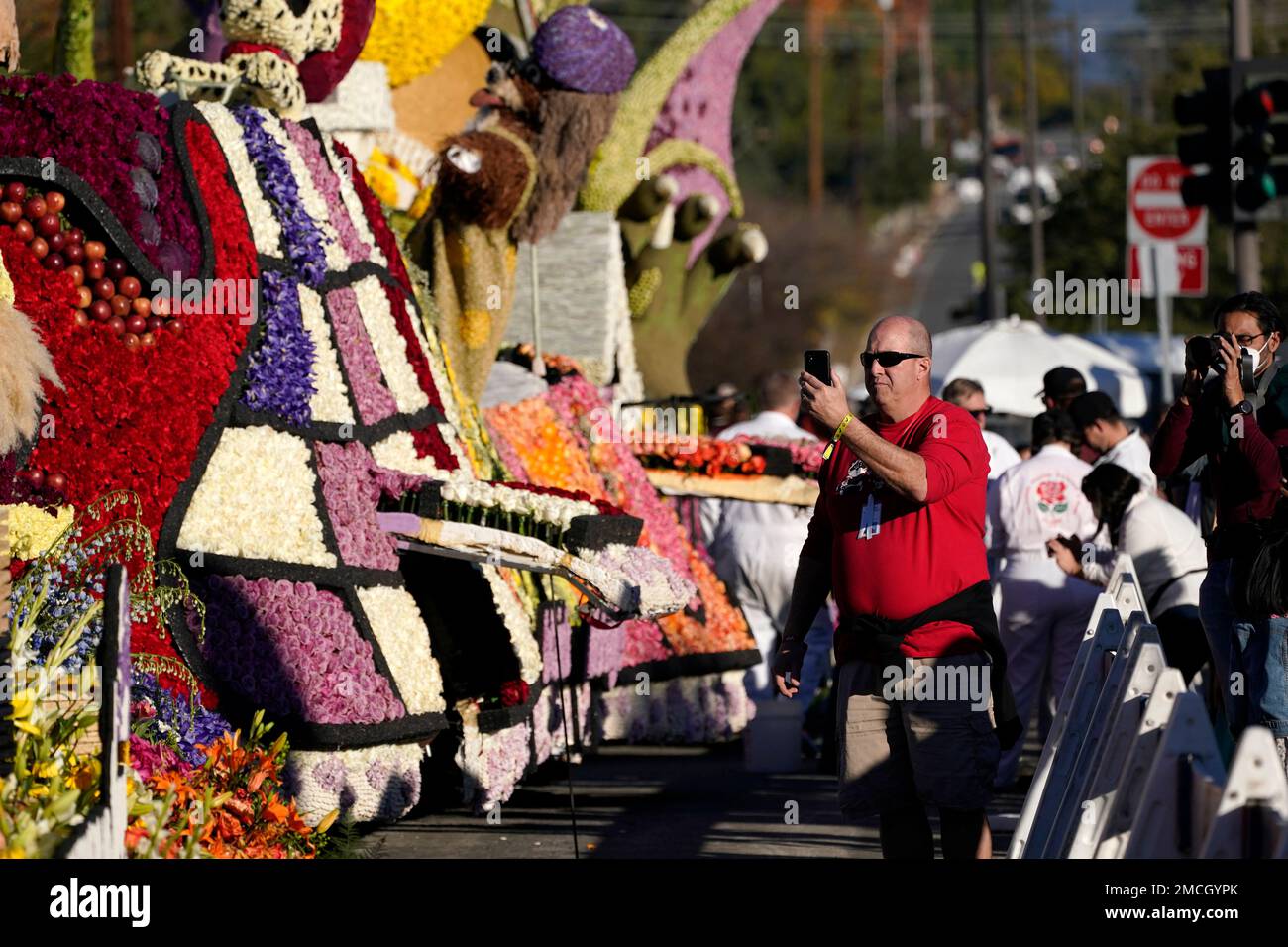 People take pictures of Rose Parade floats on display Sunday, Jan. 2 ...