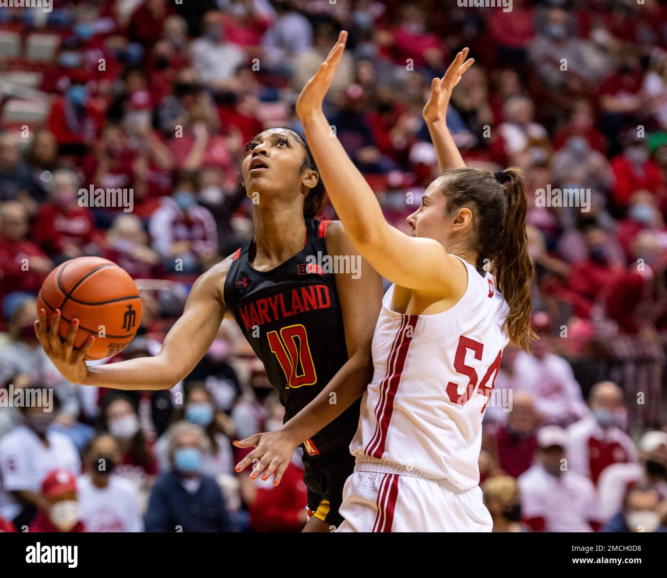 Maryland forward Angel Reese (10) takes a shot as she's defended by ...