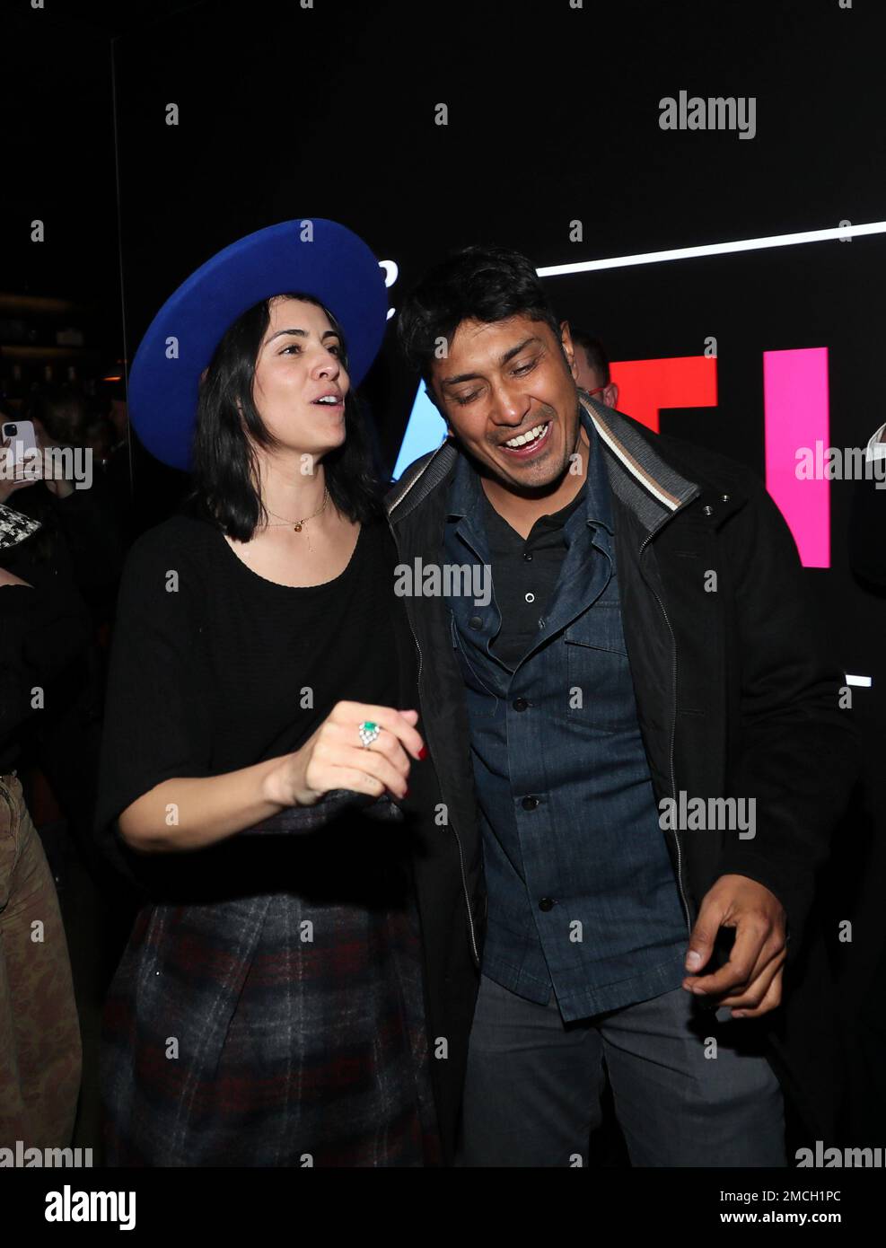 Co-founder of The Latinx House Olga Segura and Tenoch Huerta dance ...