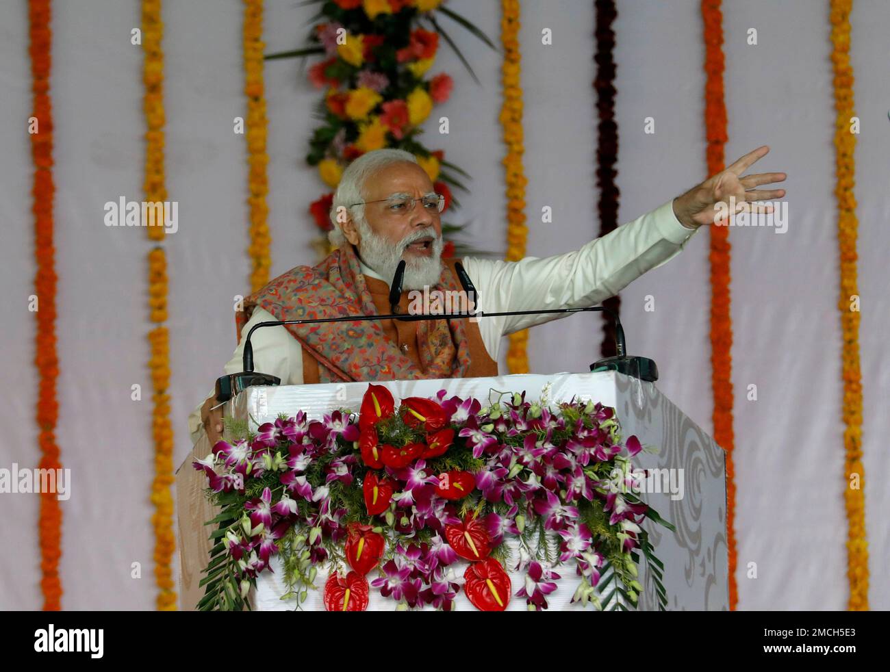 Indian Prime Minister Narendra Modi speaks as he lays the foundation ...