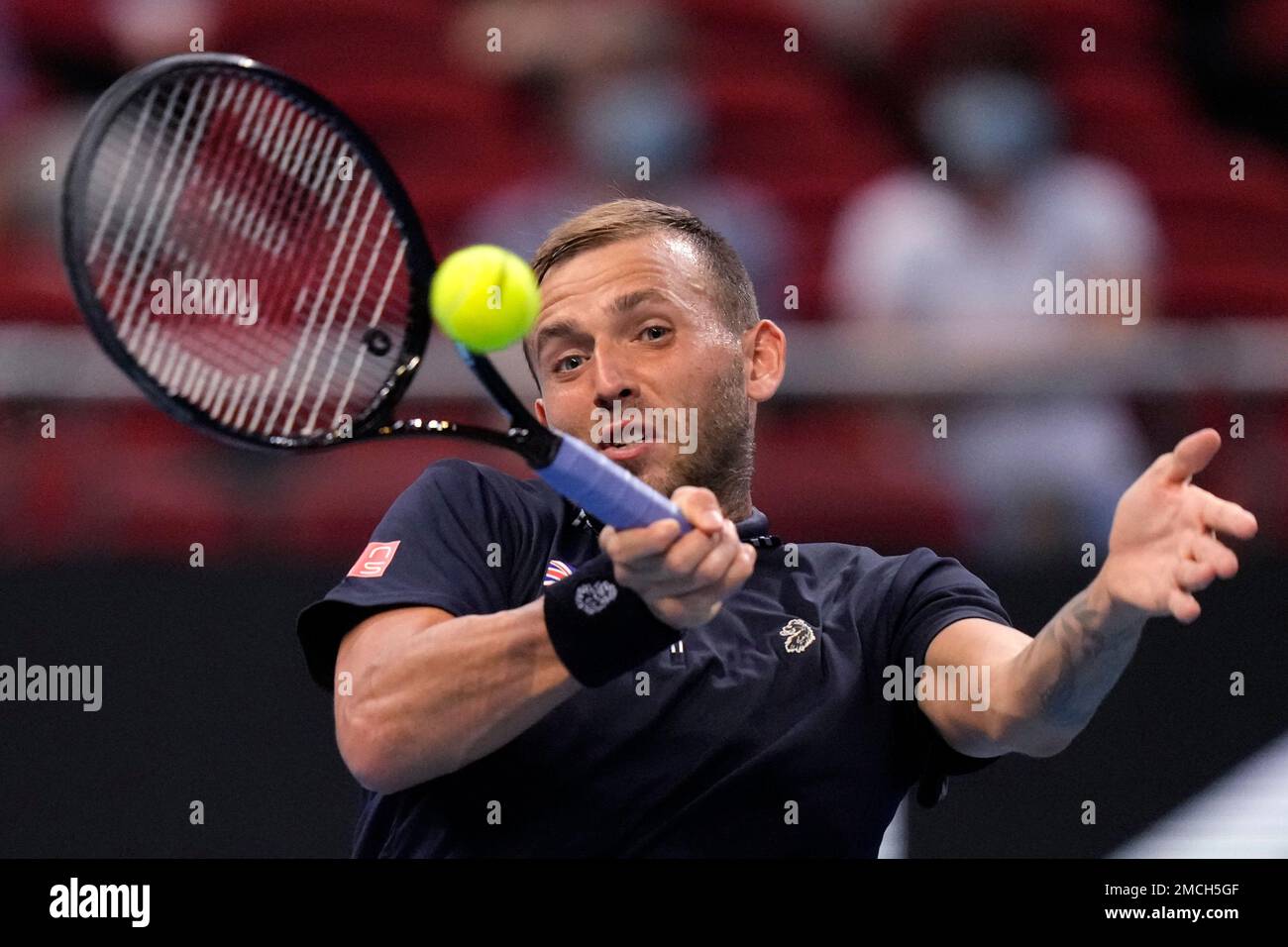 Britain's Daniel Evans hits a forehand to Germany's Jan-Lennard Struff ...