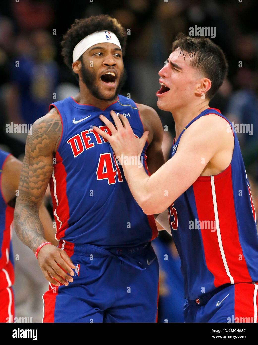 Detroit Pistons forward Saddiq Bey, left, celebrates with center Luka ...