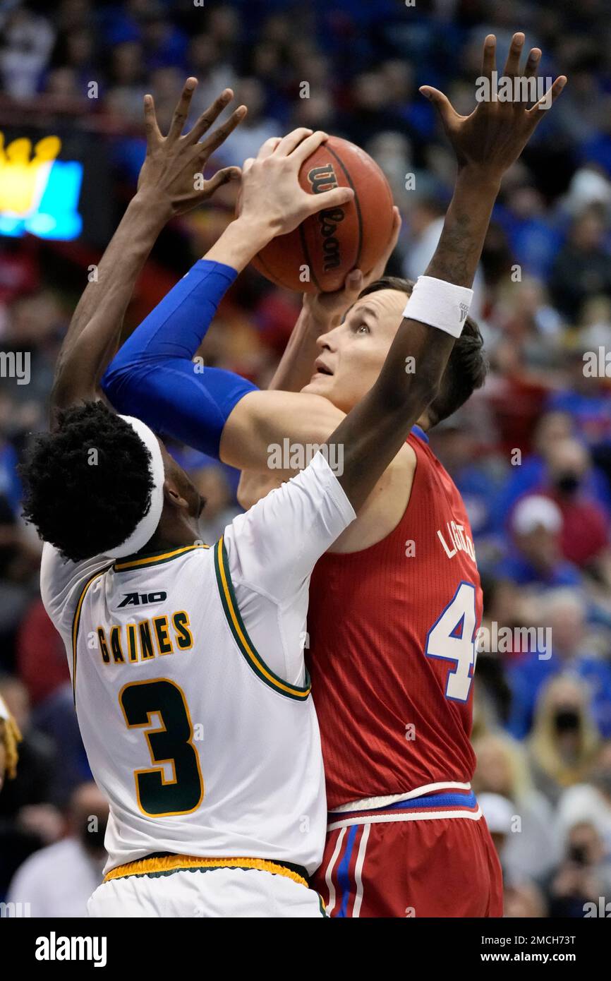 Kansas forward Mitch Lightfoot (44) shoots over George Mason guard ...