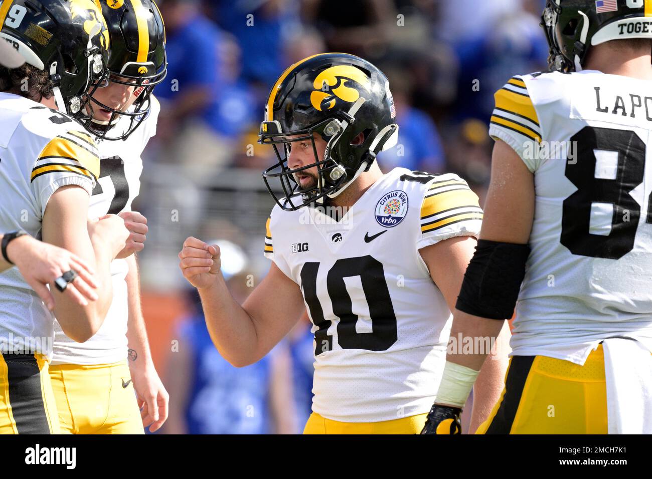 Iowa place kicker Caleb Shudak (10) is congratulated after kicking a ...