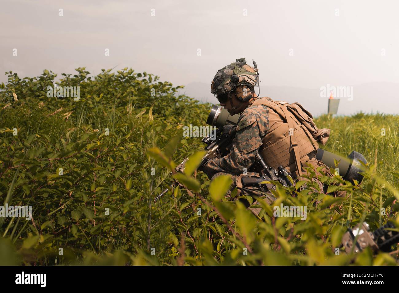 U.S. Marine Corps Cpl. Luke Moser (front) and Cpl. Byron Corriveau ...
