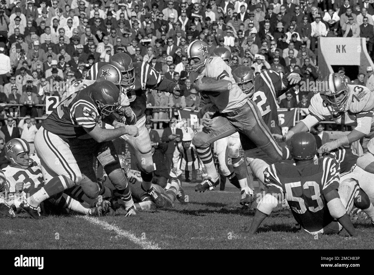 FILE - Dallas Cowboys running back Dan Reeves (30) is airborne as he ...