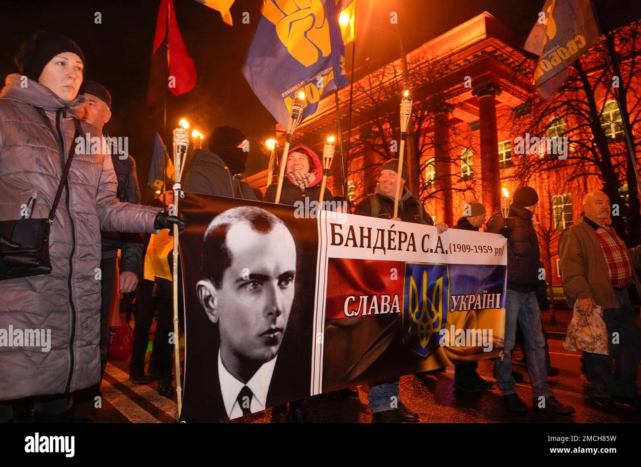 Activists of various nationalist parties carry torches and a portrait ...